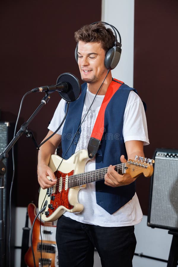 Singer Playing Electric Guitar in Recording Studio Stock Photo - Image ...
