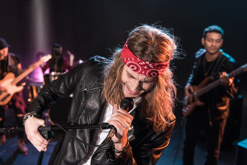 Singer with Rock and Roll Band Performing Music on Stage Stock Image ...