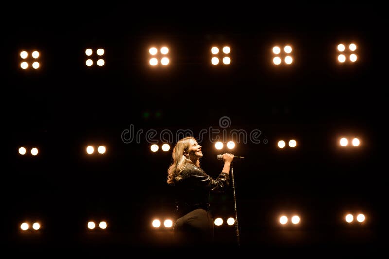 Singer on Scene in the Club. Bright Stage Lighting. Stock Image - Image ...