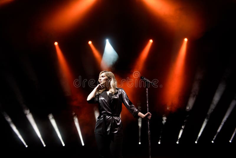 Singer on Scene in the Club. Bright Stage Lighting. Stock Image - Image ...