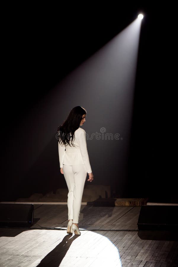 Singer on Stage in a Beam of White Light. Stock Photo - Image of ...