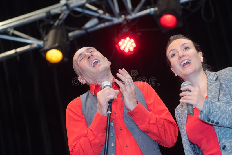 Singers Having Duet on Stage Stock Photo - Image of couple, talent ...