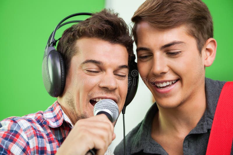 Singers Performing in Recording Studio Stock Image - Image of male ...