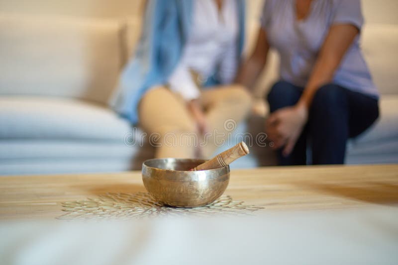 Singing Bawl on the Table with People on Background Stock Photo - Image ...