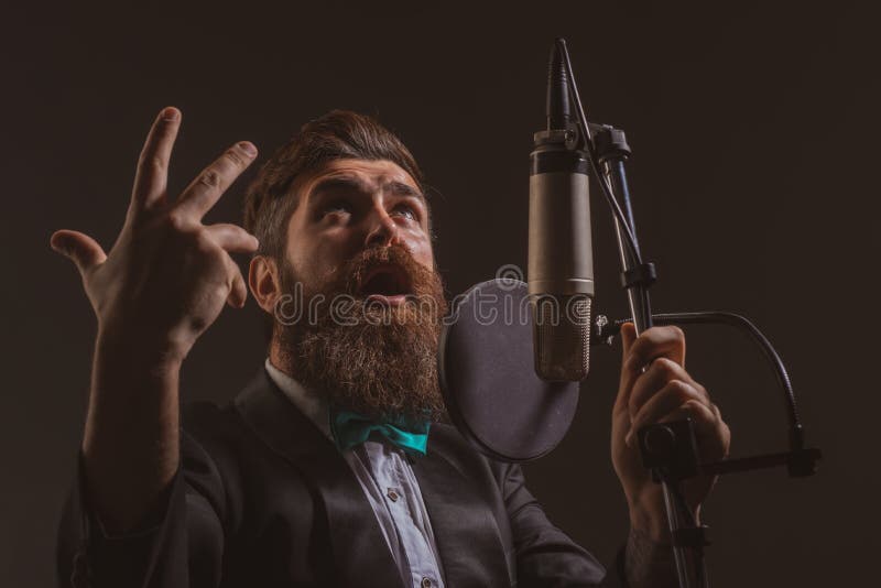 Singing Man in a Recording Studio. Expressive Bearded Man with ...