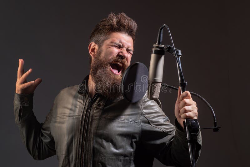Singing Man in a Recording Studio. Expressive Bearded Man with ...