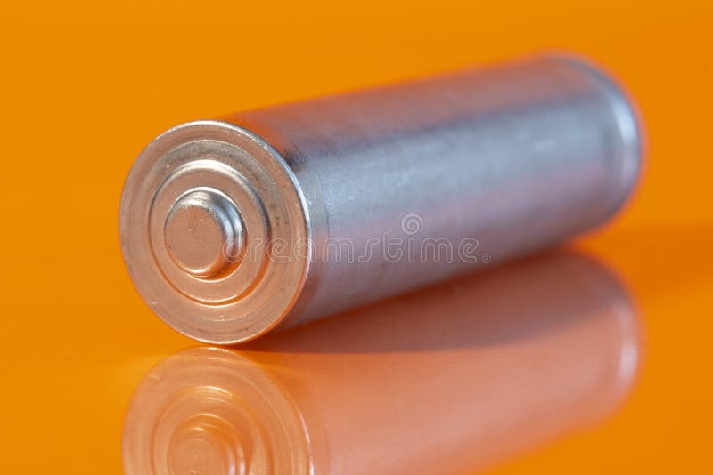 Single AA battery stock photo. Image of equipment, orange - 156376166
