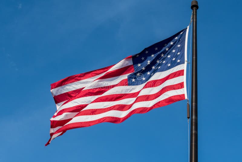 Single American Flag on Blue Sky Stock Image - Image of pride, stripes ...