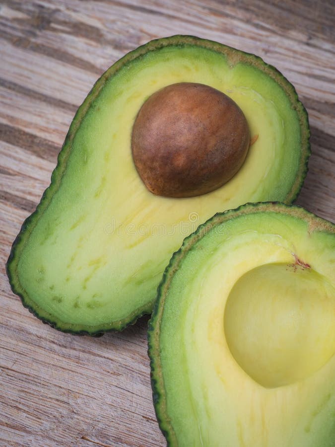 An Avocado Fruit Cut in Half Stock Photo - Image of ingredient, exotic ...