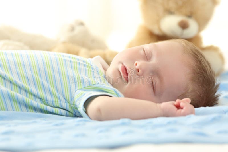 Single Baby Sleeping on a Bed Stock Image - Image of blanket, blue ...