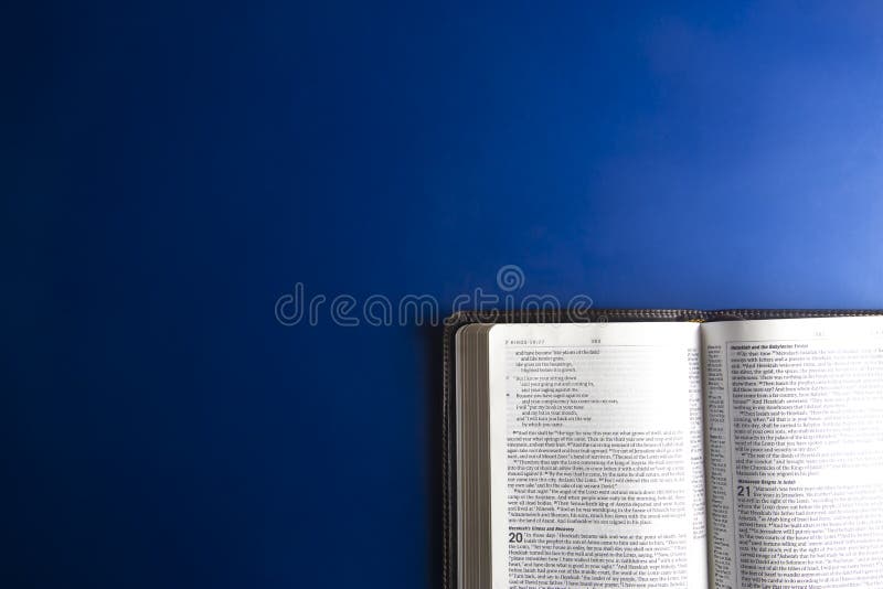 Single Bible Open on an a Blue Background Stock Photo - Image of single ...