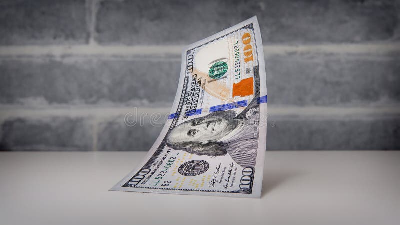 Single $100 Bill on Plain Background for Financial Concepts Stock Photo ...