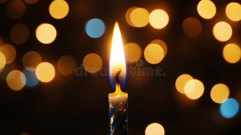 A Single Birthday Candle Burning with Bokeh Lights in the Background ...