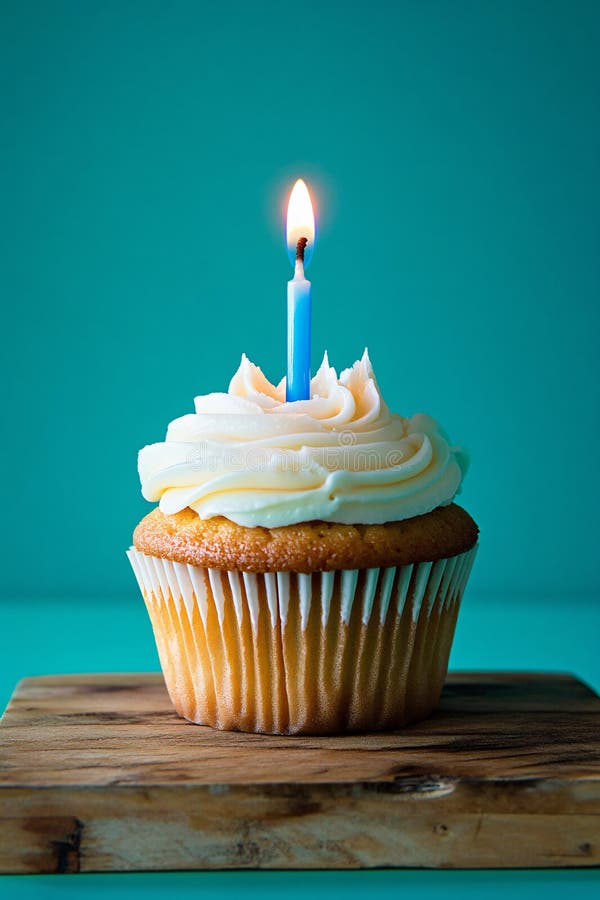 Single Birthday Cupcake with Lit Candle Teal High Quality Image Stock ...