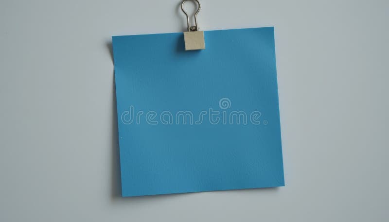 A Single Blue Square Sticky Note Hangs on a White Wall, Ideal for ...