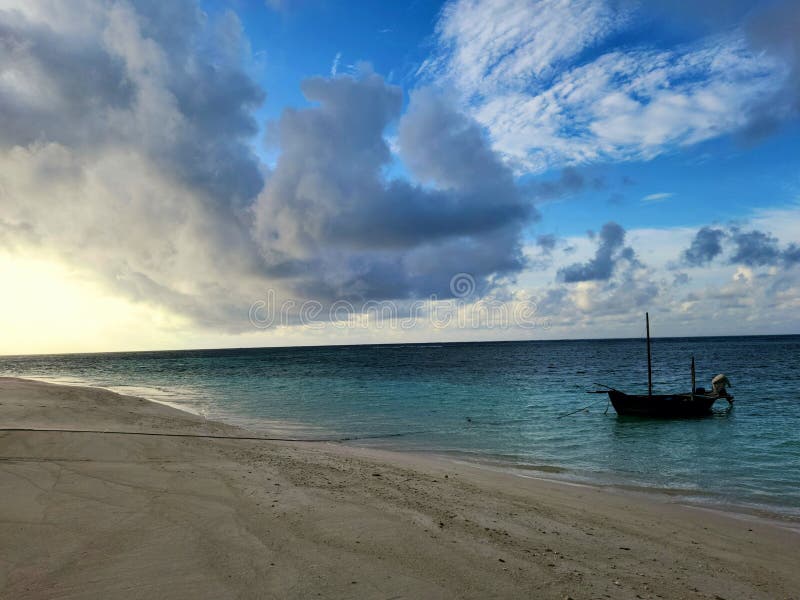 Single boat in beach side stock image. Image of shore - 259736639