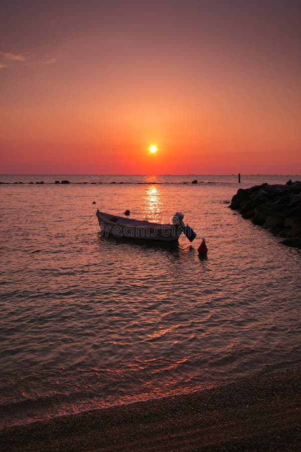 Single Boat with Burning Sun on the Sea Stock Image - Image of coast ...