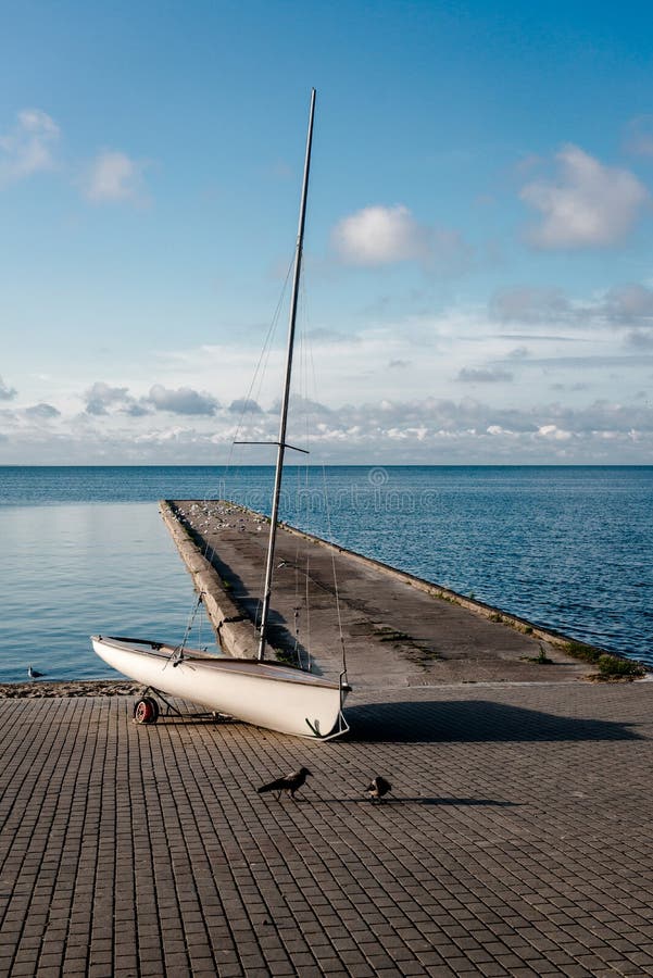 Single Boat in the Nida Pier Stock Image - Image of peaceful, boat ...