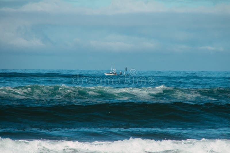 Single Boat Sailing in the Middle of the Wavy Sea during Daytime Stock ...