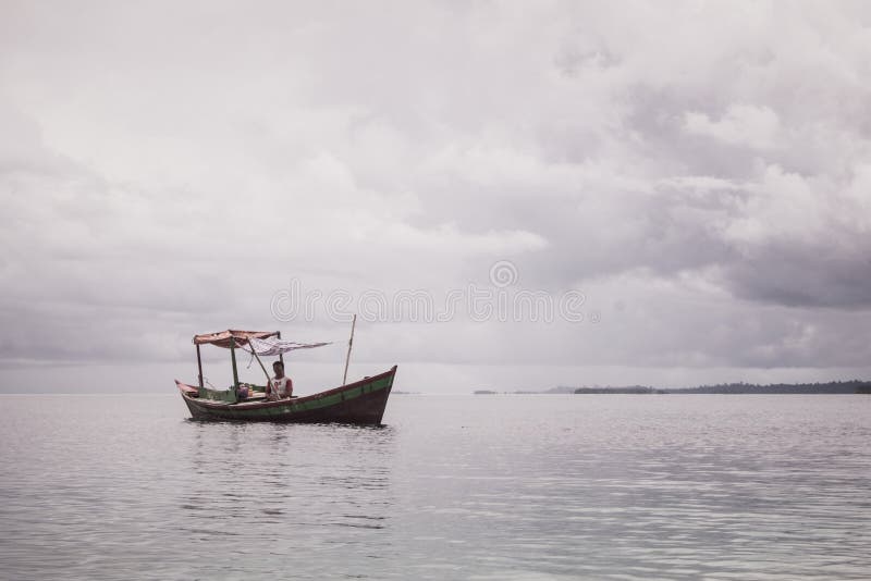Single boat in the sea editorial image. Image of clouds - 108951050
