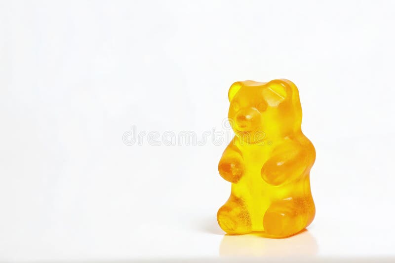 Bright Yellow Gummy Bear on a White Background in a Simple Display ...