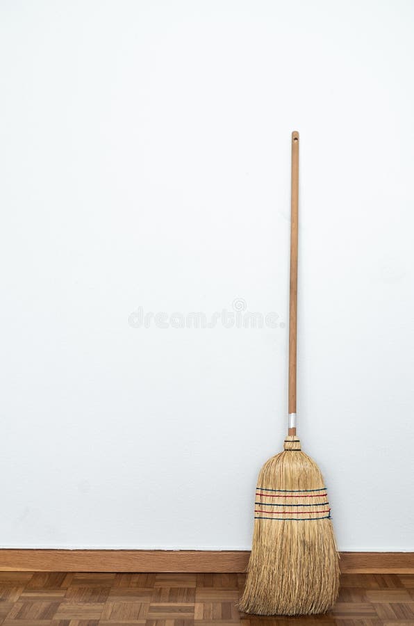 Broom against white wall stock photo. Image of broomstick - 115652502