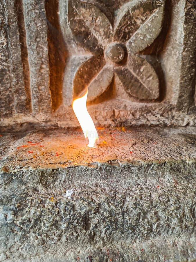 Single Burning Camphor Flame Placed on an Ancient Stone Surface with ...