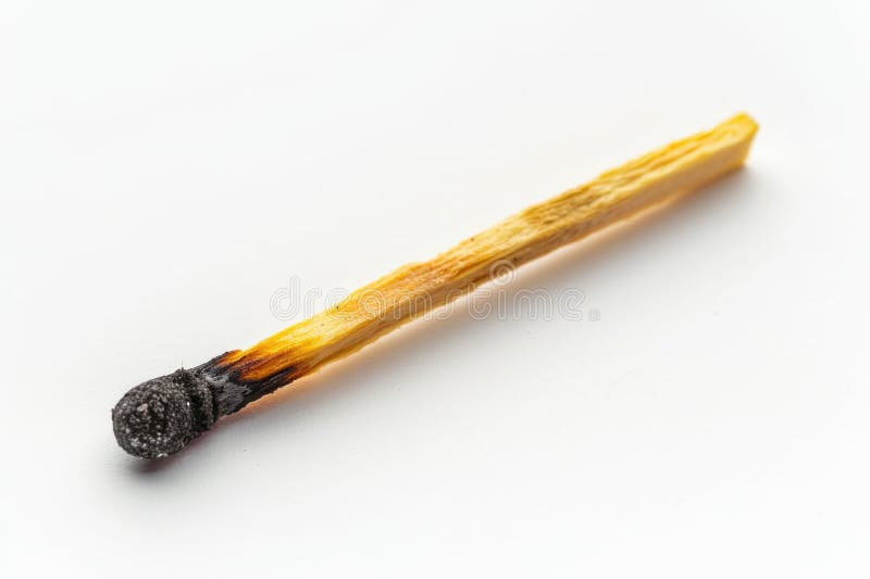 A Single Burnt Matchstick Lies on a White Surface, with a Hint of Ash ...