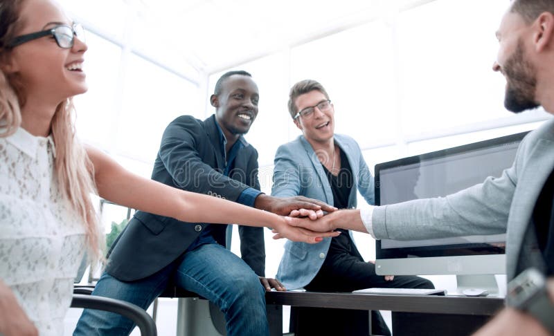 Single Business Team with Their Hands Folded Together Stock Image ...