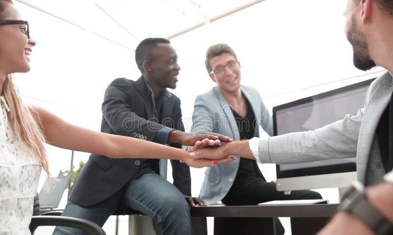 Single Business Team with Their Hands Folded Together Stock Photo ...