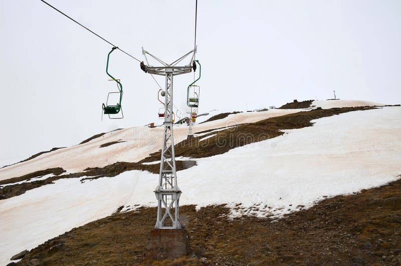 Single Cable Car with Colorful Seats on a Snowy Mountain. Bottom Stock ...