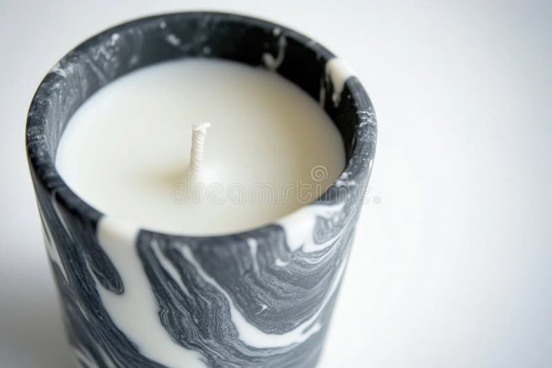 A Single Candle Sitting on a Wooden Table in a Simple Setting Stock ...