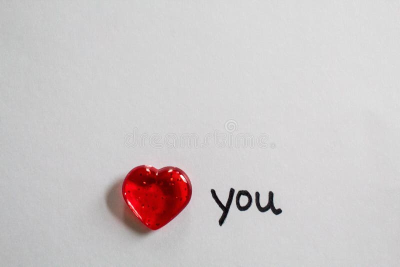 Single Clear Red Heart on White Background with Handwritten Note Stock ...