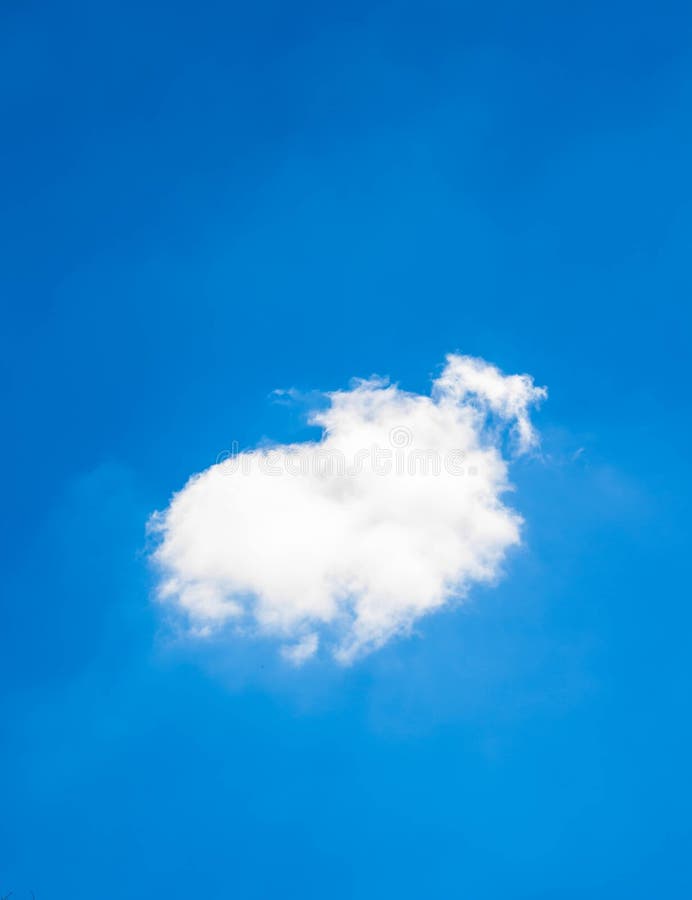 An Isolated Single Cloud in the Blue Sky on a Bright Sunny Day. Stock ...