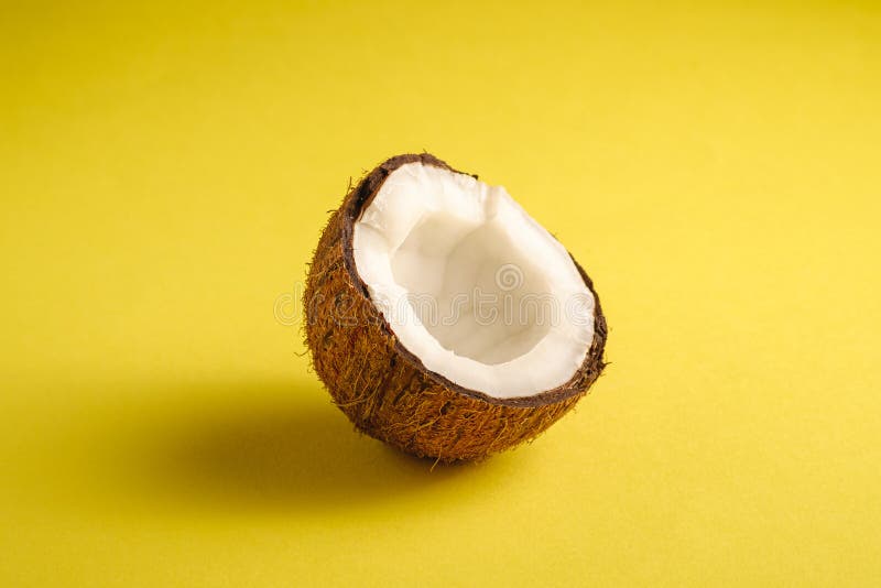 Single Coconut Fruit On Yellow Plain Background, Abstract Food Tropical ...