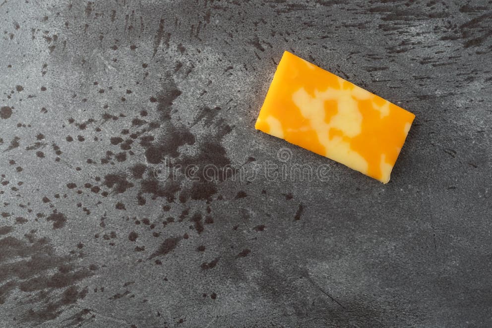 Single Colby Jack Cheese Bar Offset on a Gray Background Top View Stock ...