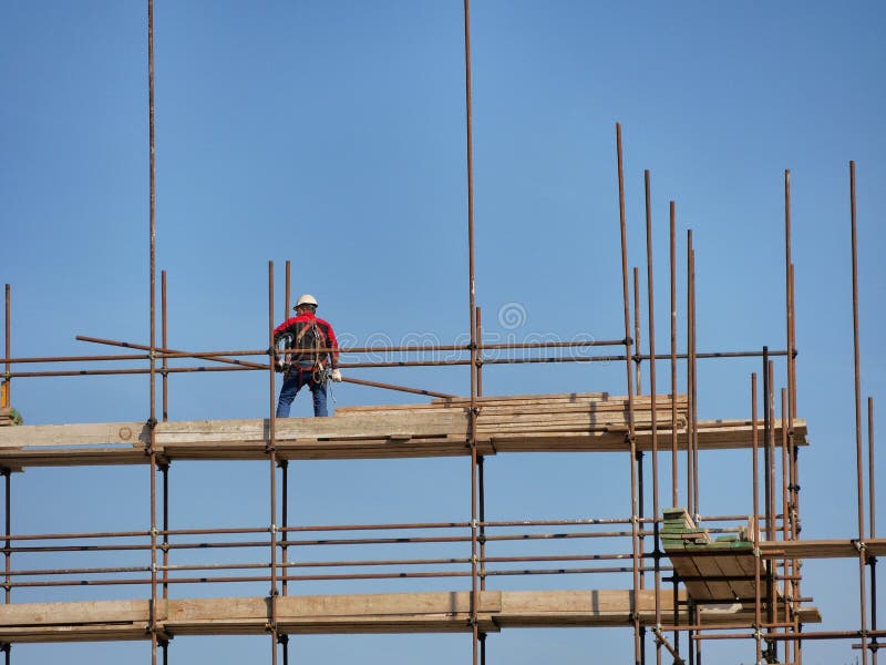 Single Construction Worker on Construction Site Scaffolding Stock Photo ...