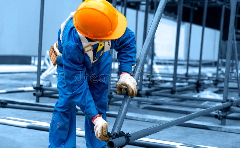 Construction Worker Working on Scaffolding Stock Photo - Image of ...