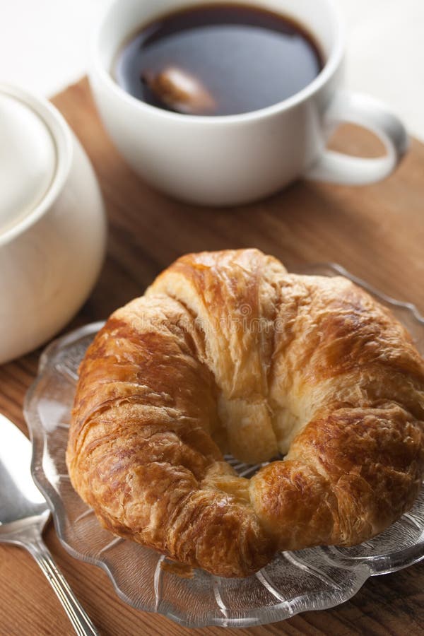 Single Croissant with Tea stock photo. Image of single - 25294262
