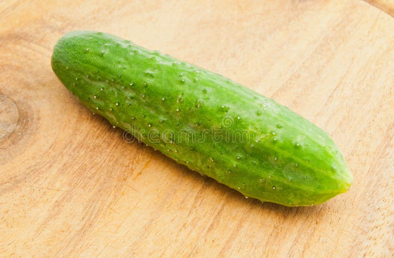 Single Cucumber on Cutting Board Stock Image - Image of cucumber ...