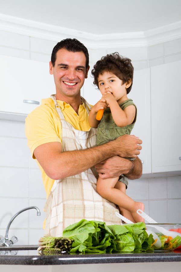 Dad and Son Making Cookies. Stock Photo - Image of father, male: 4246492