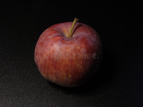 A Single Dark Red Apple on Black Stock Photo - Image of fruit ...