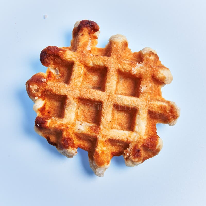 Single Delicious Waffle Over Blue Background Stock Image - Image of ...
