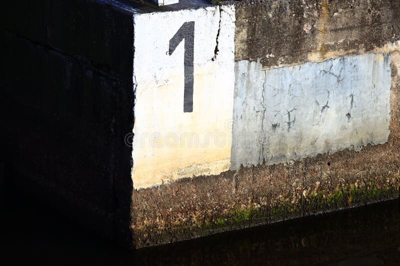 A Single Digit Painted on a Gray Concrete Wall, with a Bold Stroke and ...