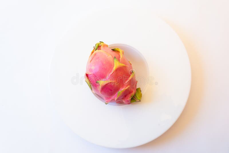 Single Dragon Fruit in a Wide White Bowl, Centered Stock Photo - Image ...