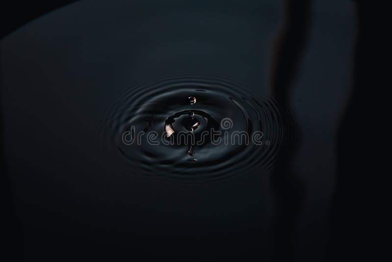 Single Drop of Liquid Over the Surface in Blue and Grey Tones Stock ...