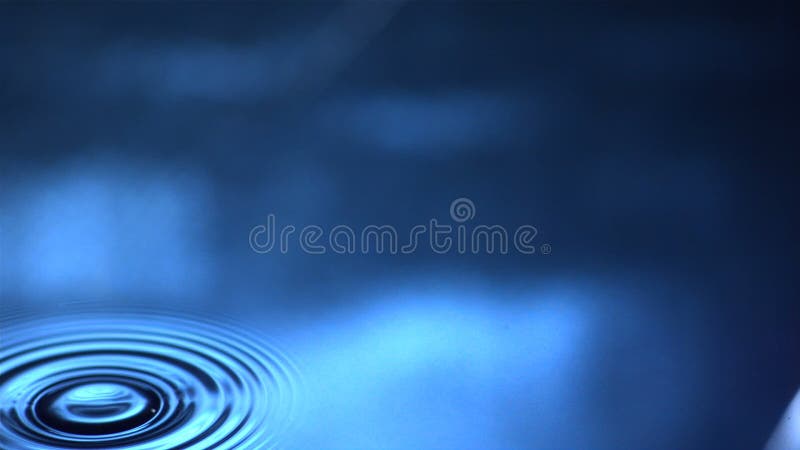 Slow Motion Water Drop Splash into Calm Water - Shot with Ultra High ...