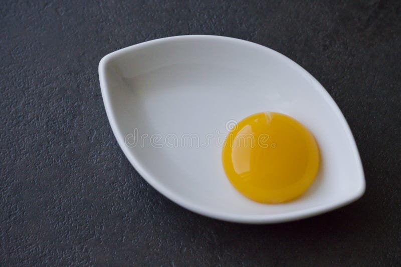 Egg Yolk in a Dish stock image. Image of delicious, nature - 104787729