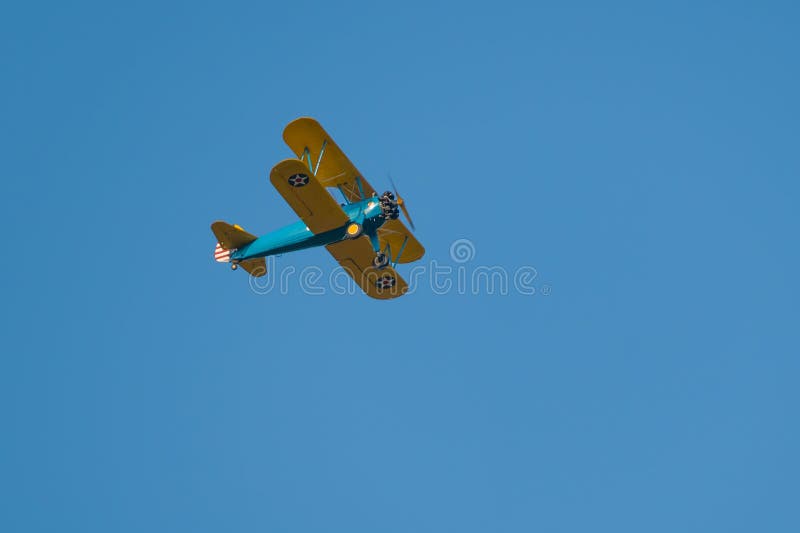 Single-engine Biplane Flying in Clear Blue Sky Stock Image - Image of ...
