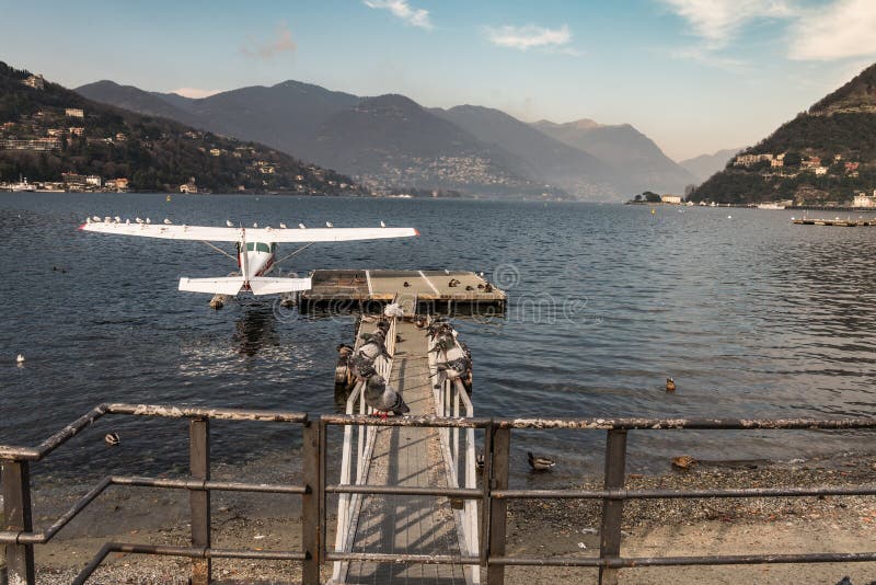 A Single Engine Piston Seaplane is Moored at the Pier Stock Photo ...